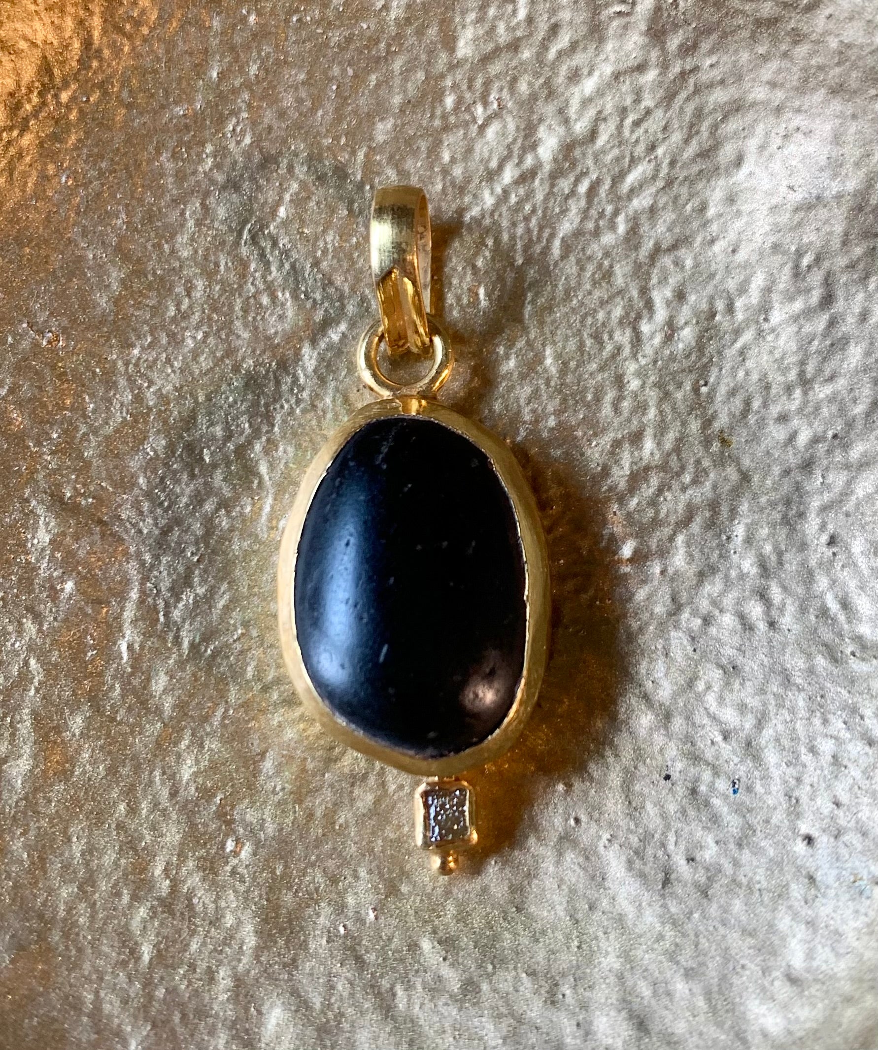 20k gold Basalt and Diamond Pendant